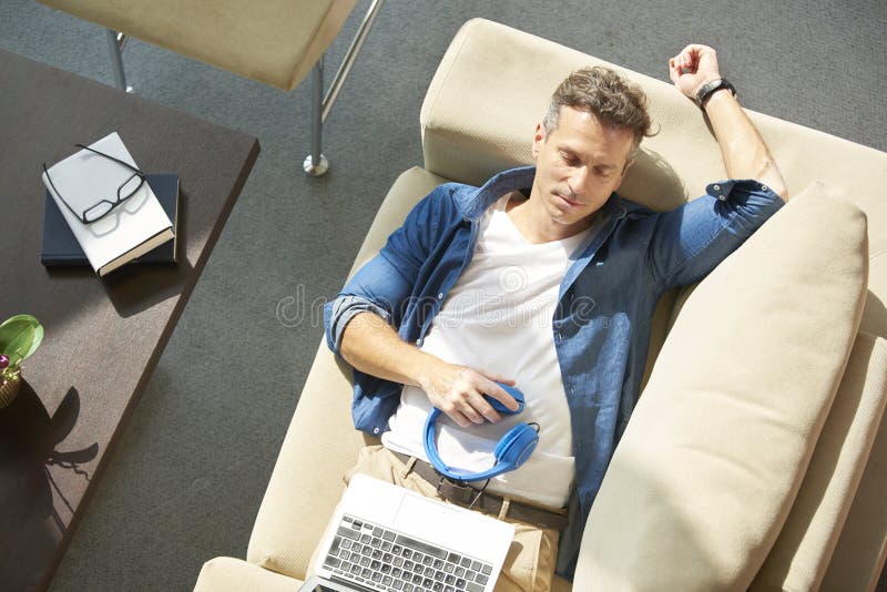 Relaxed man at home stock image. Image of relaxing, home - 79476855