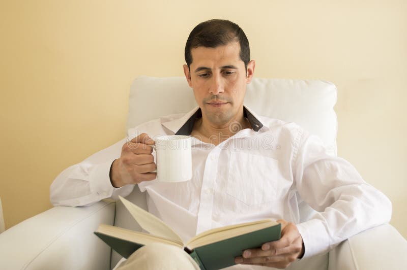 Relaxed man reading a book stock image. Image of male - 30814053