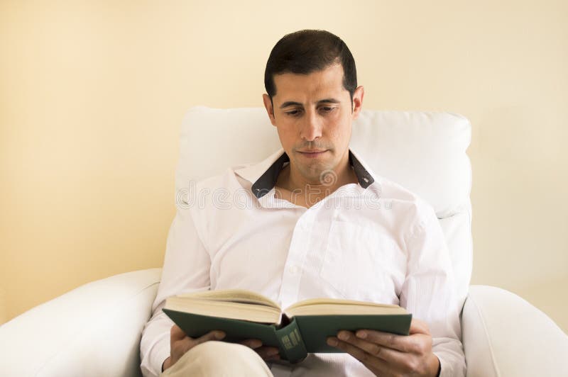 Relaxed man reading a book stock image. Image of read - 30814205