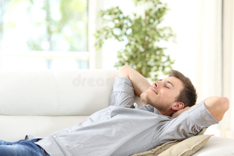 Relaxed Man Resting on a Couch at Home Stock Photo - Image of house ...
