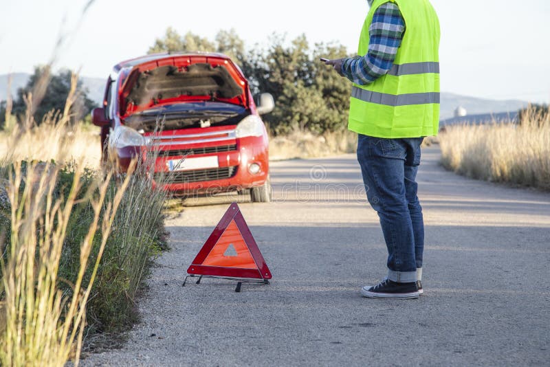 Relaxed Man Texting a Mechanic because His Car Broke Down in the Middle ...