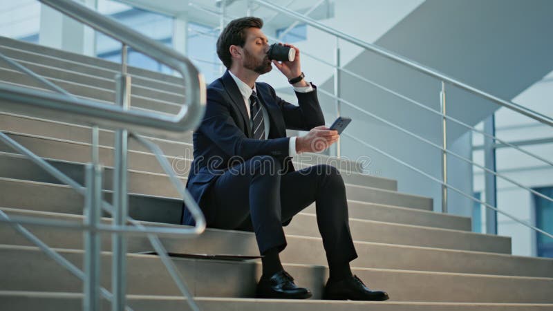 Relaxed Manager Looking Smartphone Sitting Stairs with Coffee ...