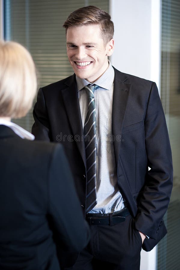 Relaxed Managers Communicating Cheerfully Stock Image - Image of ...
