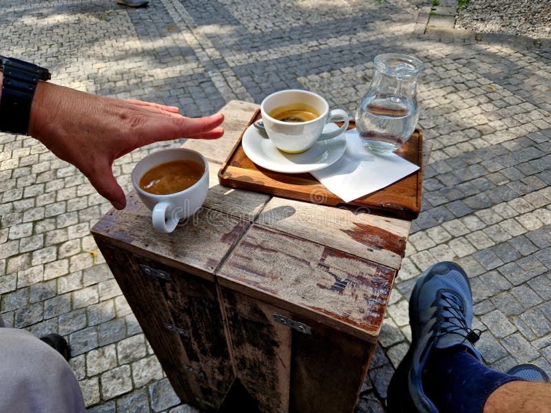 A Relaxed Meeting for a Quick Chat on the Street at a Table Made of a ...