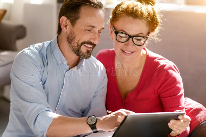 Relaxed Middle Aged Couple Relaxing at Home Stock Photo - Image of ...