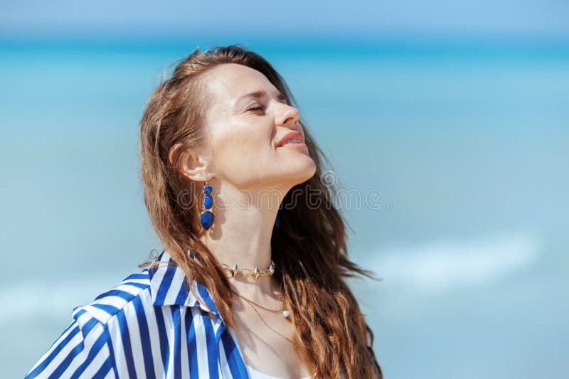 Relaxed Modern Woman on Seashore Enjoying Tranquility Stock Image ...