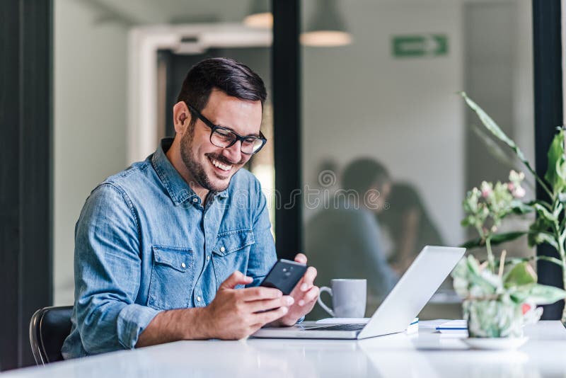 Relaxed Office Worker, Checking Notifications, during Work Stock Photo ...