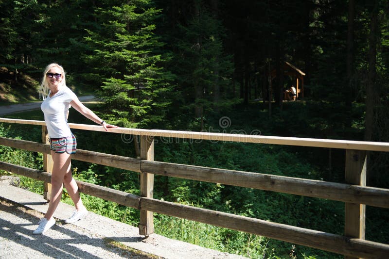 Relaxed Pose Leaning Against a Bridge Railing Stock Image - Image of ...