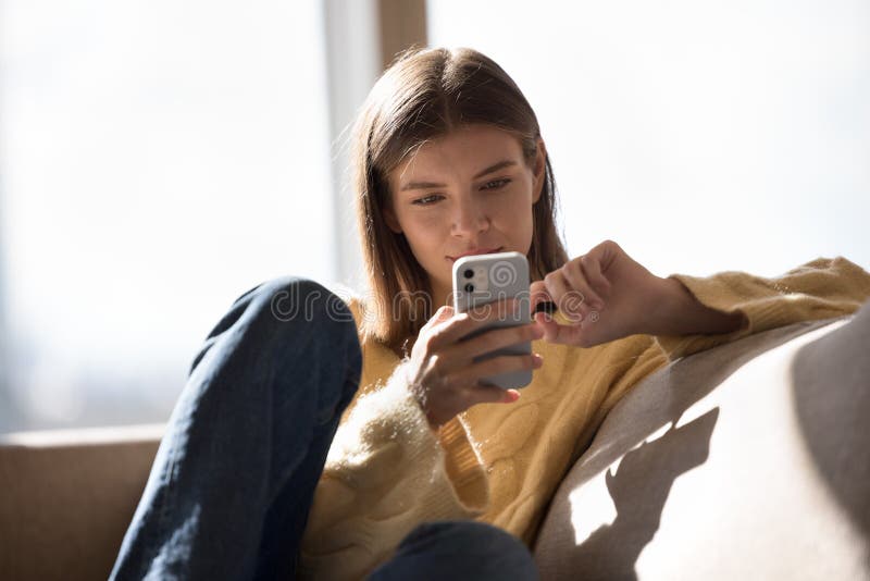 Relaxed Positive Millennial Cellphone User Girl Using Online ...
