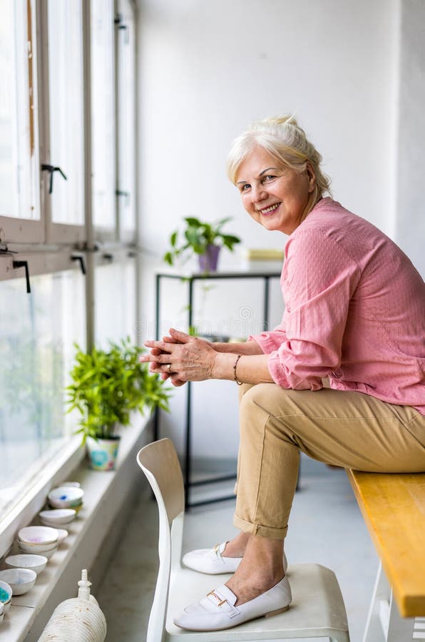 Relaxed Senior Woman Sitting in the Office Stock Image - Image of break ...