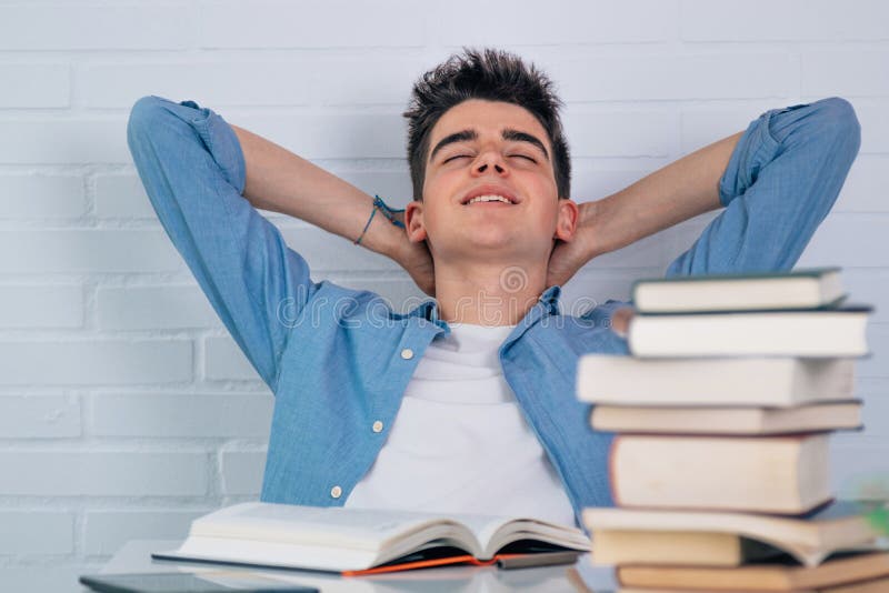 Relaxed Student at the Desk Stock Photo - Image of concepts, relaxed ...