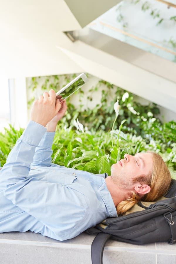 Relaxed Student with Tablet Stock Image - Image of sciences, break ...