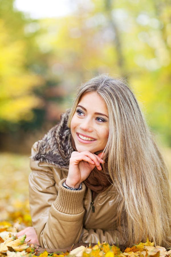Relaxed woman in autumn stock photo. Image of expression - 28009152