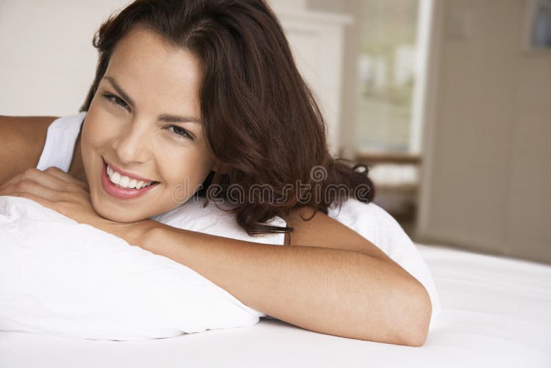 Happy Woman Laying on Bed and Looking on Mirror Stock Photo - Image of ...