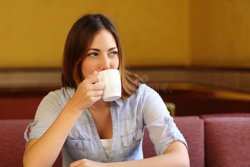 Relaxed Woman Thinking while is Drinking a Cup of Coffee Stock Image ...