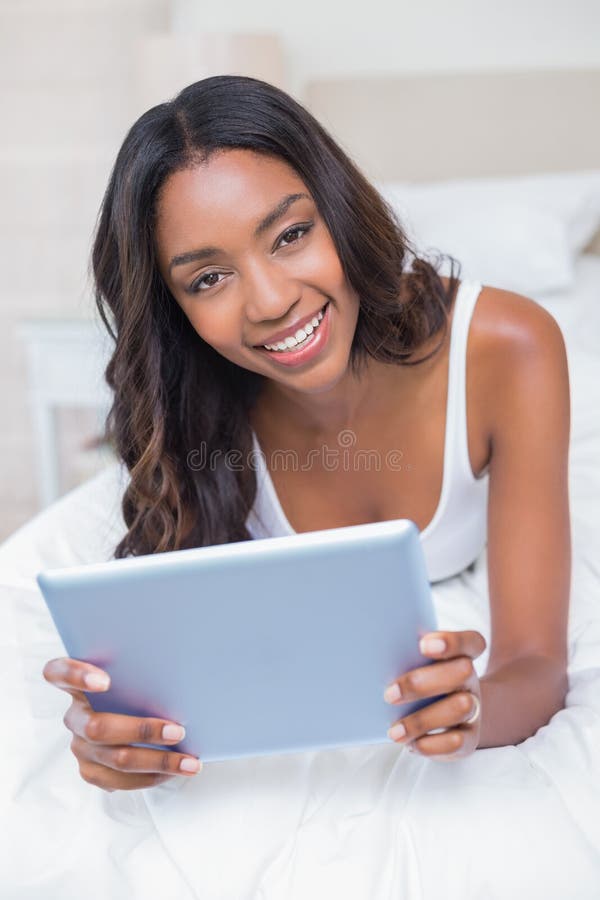 Relaxed Woman Using Tablet Pc on Bed Stock Image - Image of device ...