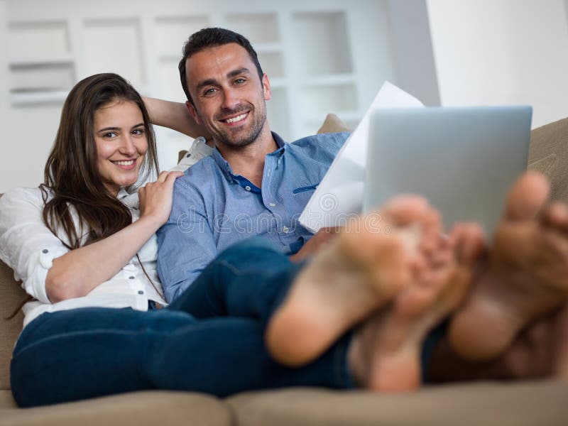 Relaxed Young Couple Working on Laptop Computer at Home Stock Image ...