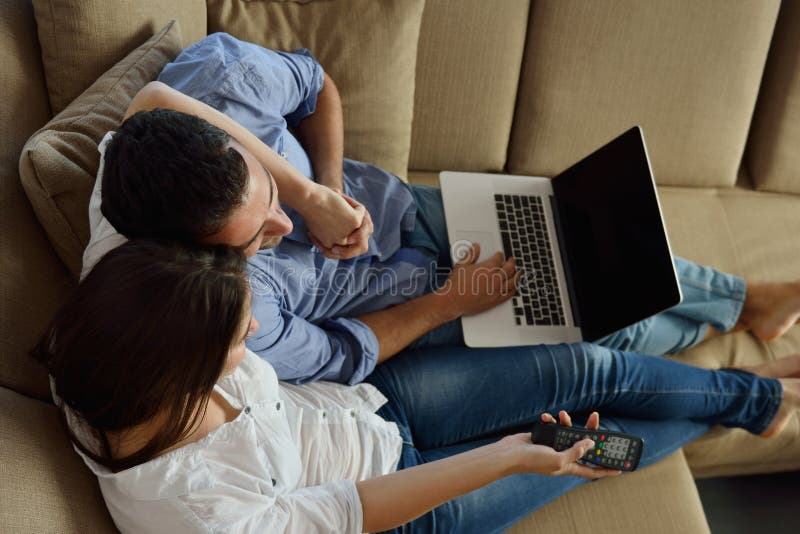 Relaxed Young Couple Working on Laptop Computer at Home Stock Image ...