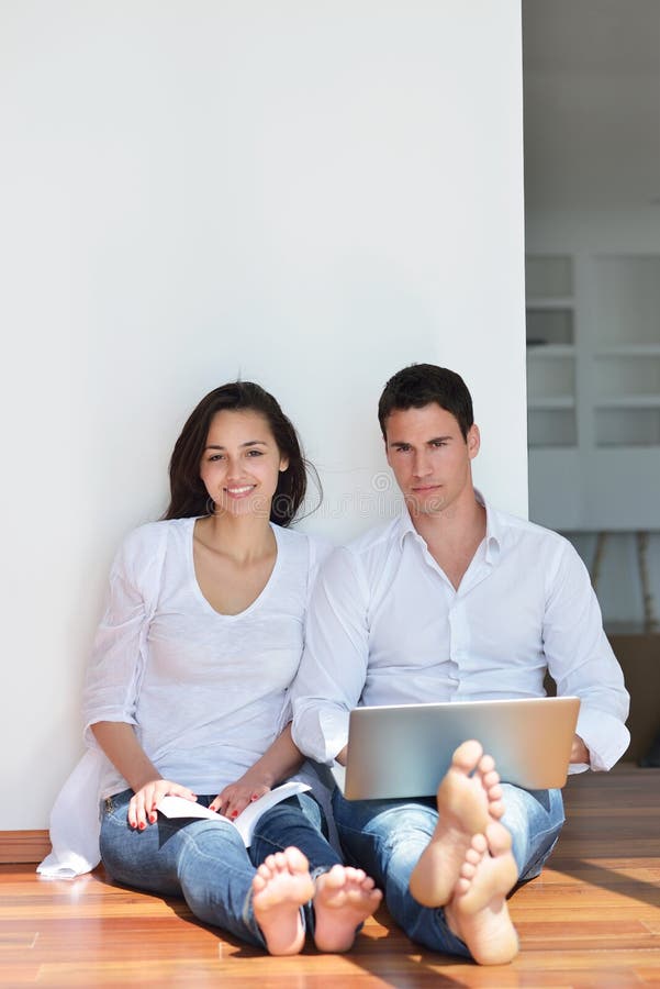 Relaxed Young Couple Working on Laptop Computer at Home Stock Image ...