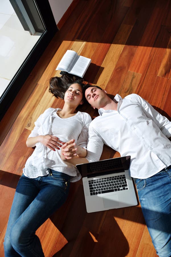 Relaxed Young Couple Working on Laptop Computer at Home Stock Image ...