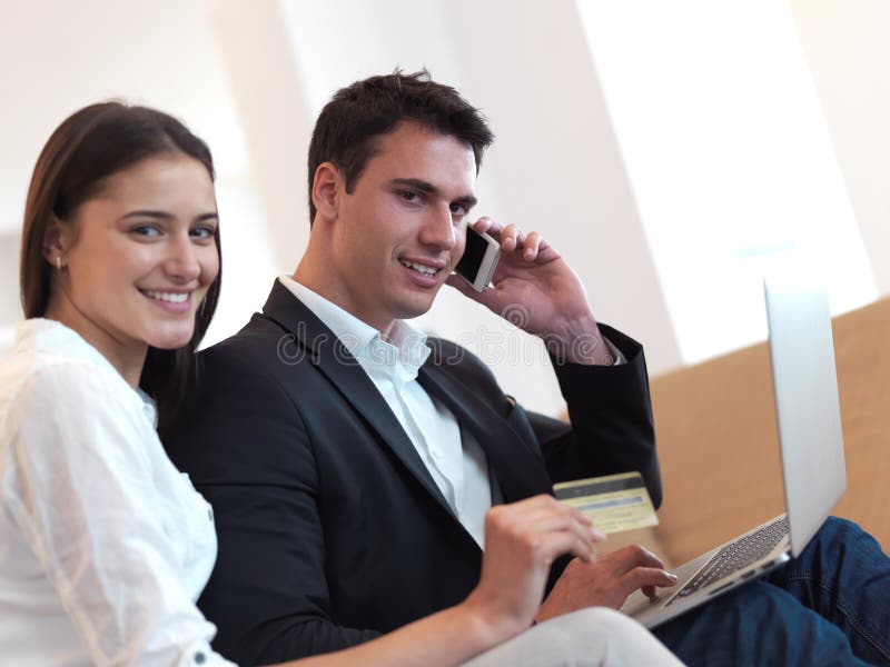 Relaxed Young Couple Working on Laptop Computer at Home Stock Image ...