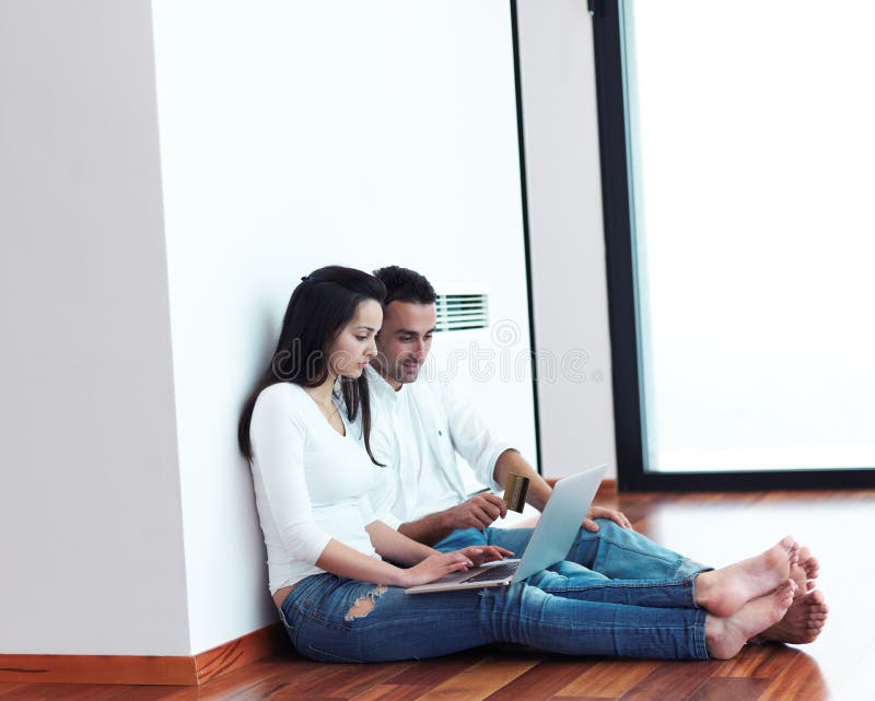 Relaxed Young Couple Working on Laptop Computer at Home Stock Image ...