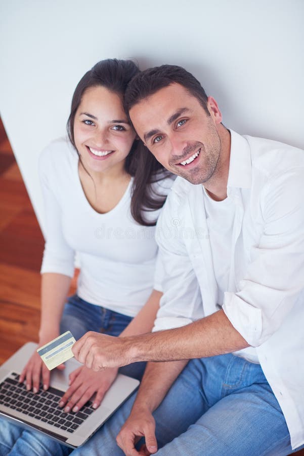 Relaxed Young Couple Working on Laptop Computer at Home Stock Photo ...
