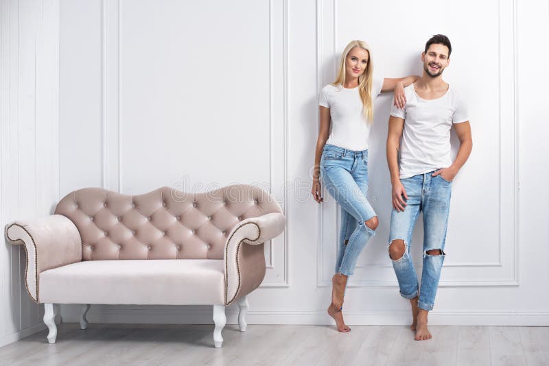 Relaxed Young People Leaning on the Decorative Wall Stock Photo - Image ...