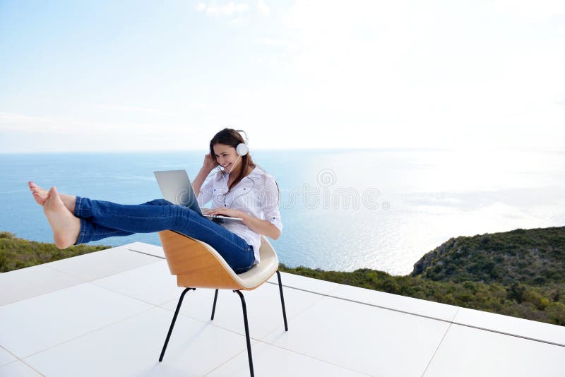 Relaxed Young Woman at Home Working on Laptop Stock Photo - Image of ...