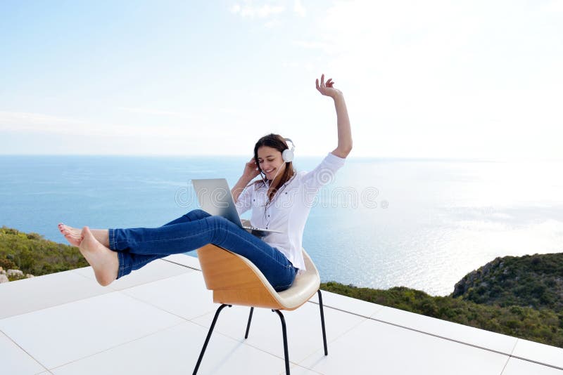 Relaxed Young Woman at Home Working on Laptop Stock Photo - Image of ...