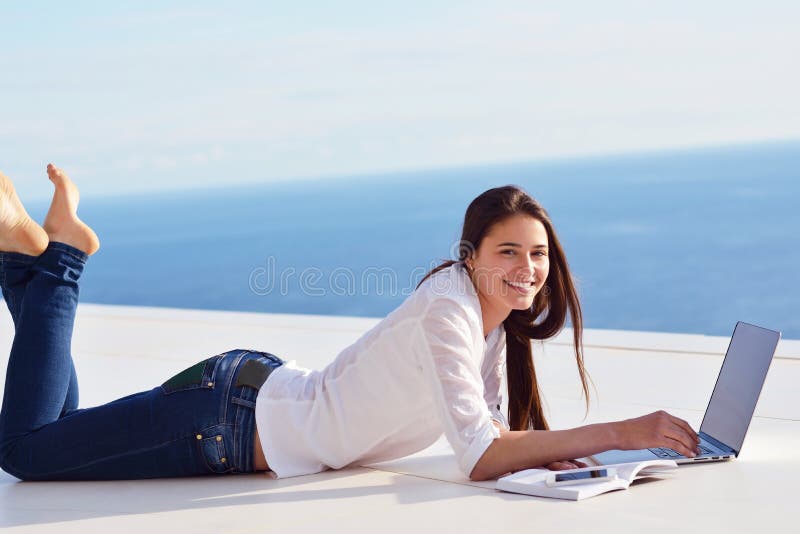 Relaxed Young Woman at Home Working on Laptop Computer Stock Image ...