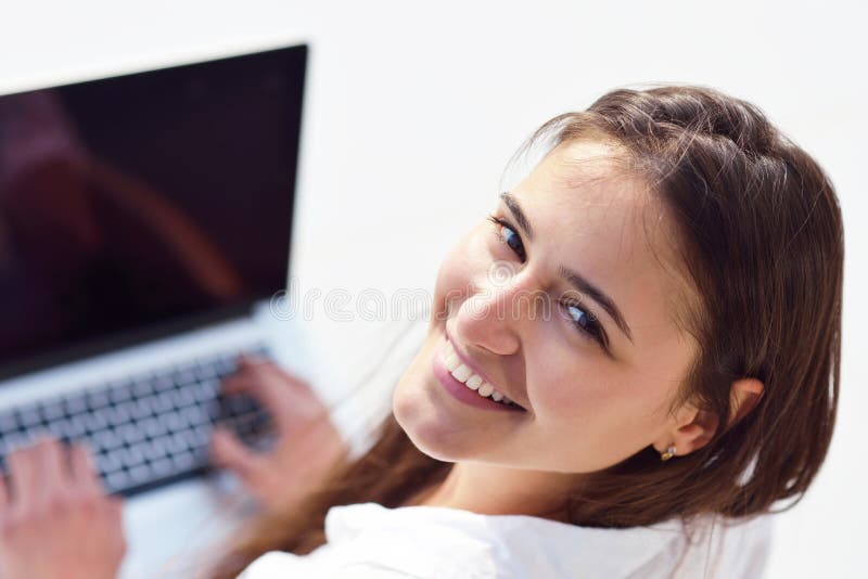 Relaxed Young Woman at Home Working on Laptop Computer Stock Photo ...