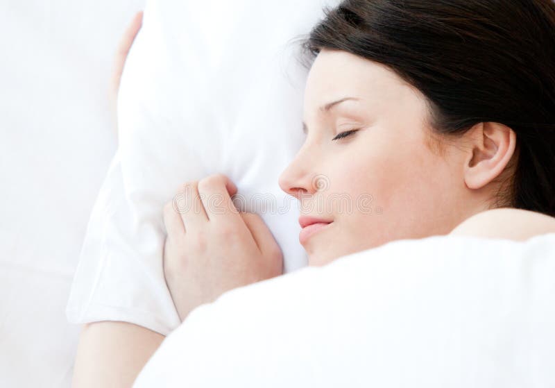 Relaxed Young Woman Lying in a Bed Sleeping Stock Image - Image of ...