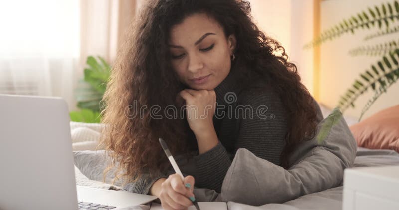 Relaxed Woman Using Laptop and Writing Notes in Bed Stock Video - Video ...
