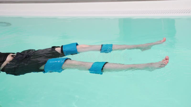 Relaxing Aquatic Exercise Individual Floating in Pool with Blue ...