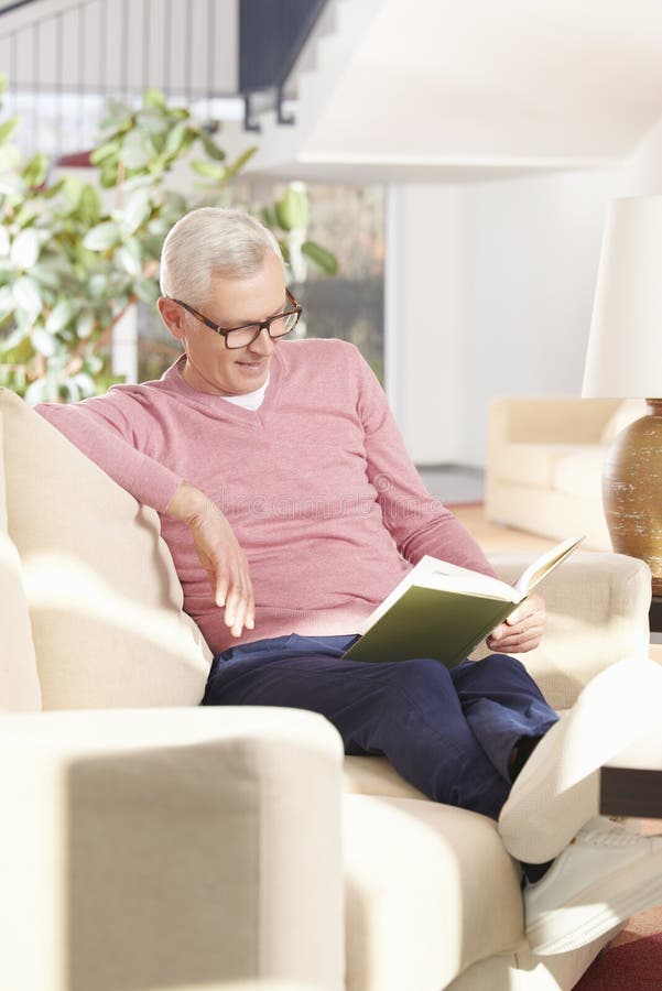 Relaxing with a book stock photo. Image of cosy, room - 86037130