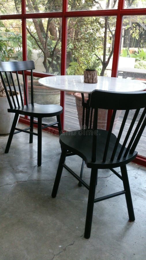 Relaxing cafe seating stock image. Image of black, tropical - 84653675