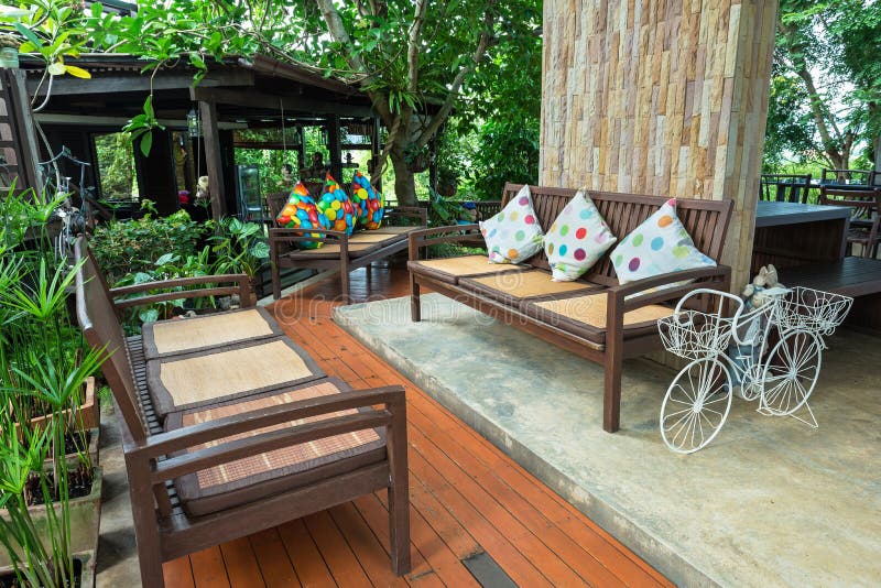 Man Relaxing in Chair at Home Streaming Music from Mobile Phone To ...