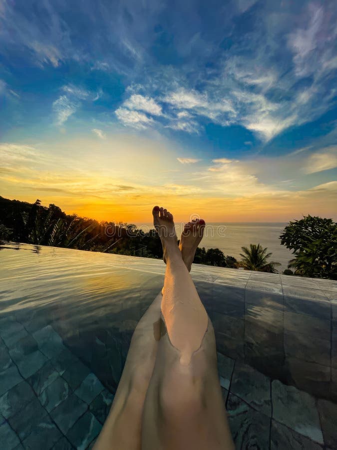 Relaxing in an Infinity Pool at Sunset with Ocean View Stock Image ...