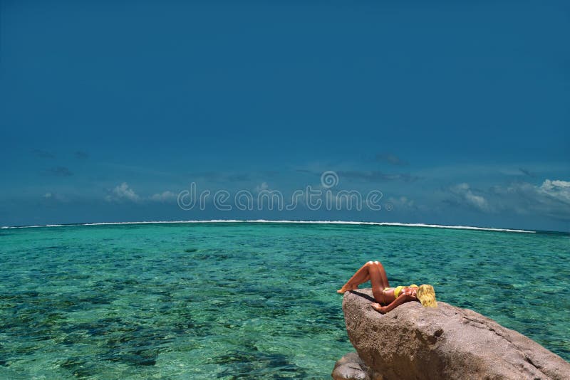 Relaxing Model on Lagoon Rock. Top & Endless. Stock Photo - Image of ...