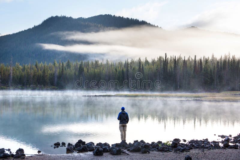 Relaxing on mountain lake stock image. Image of outdoors - 162104789