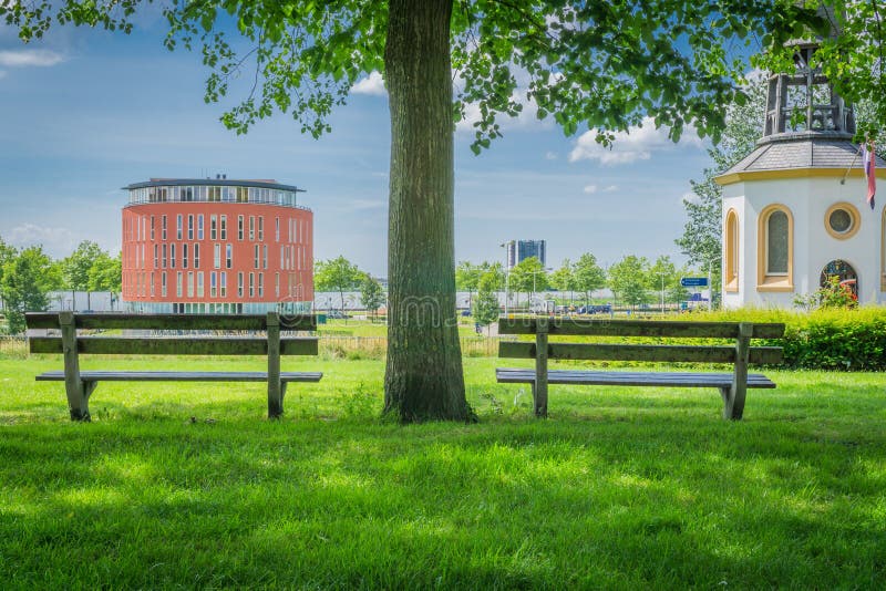 Relaxing Benches at the Park Scene with View on Buildings and Green ...