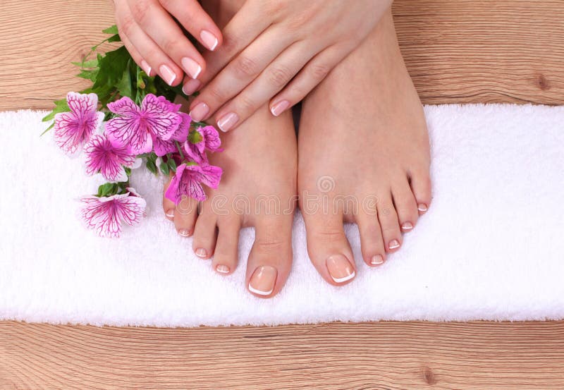 Relaxing Pink Manicure and Pedicure with a Orchid Stock Image - Image ...