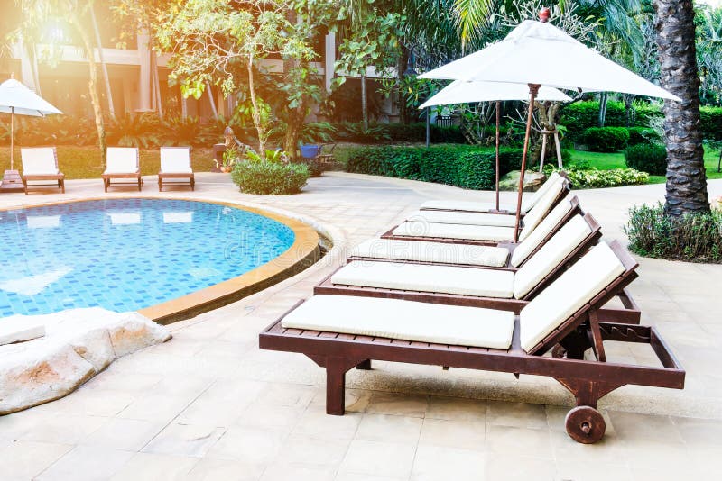Pool Bed beside Swimming Pool in Tropical Resort Stock Photo - Image of ...