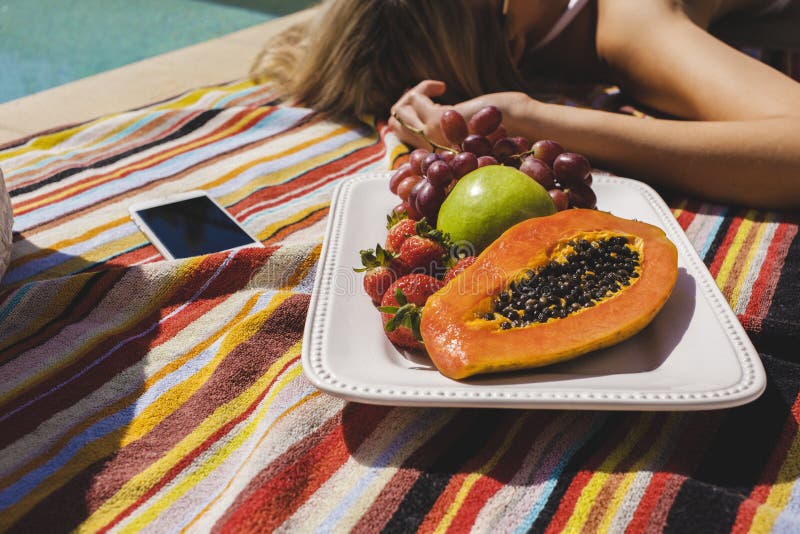 Relaxing by the Pool with Fresh Fruit. Stock Image - Image of summer ...