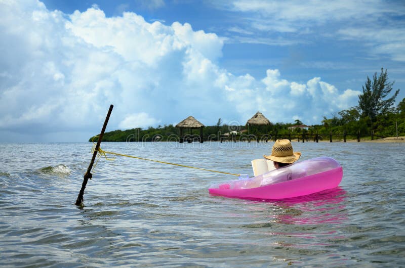 Relaxing read on the water stock photo. Image of wave - 26776690