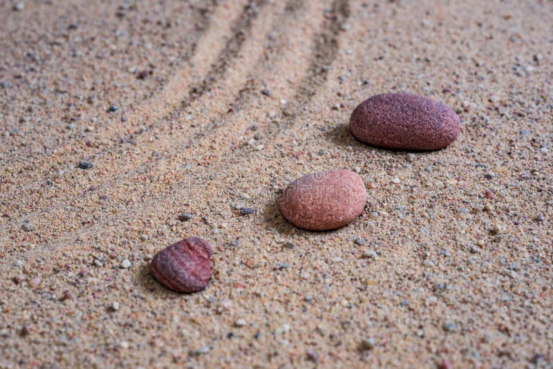 Relaxing Stones Laying on Sand Textured Pattern Stock Image - Image of ...