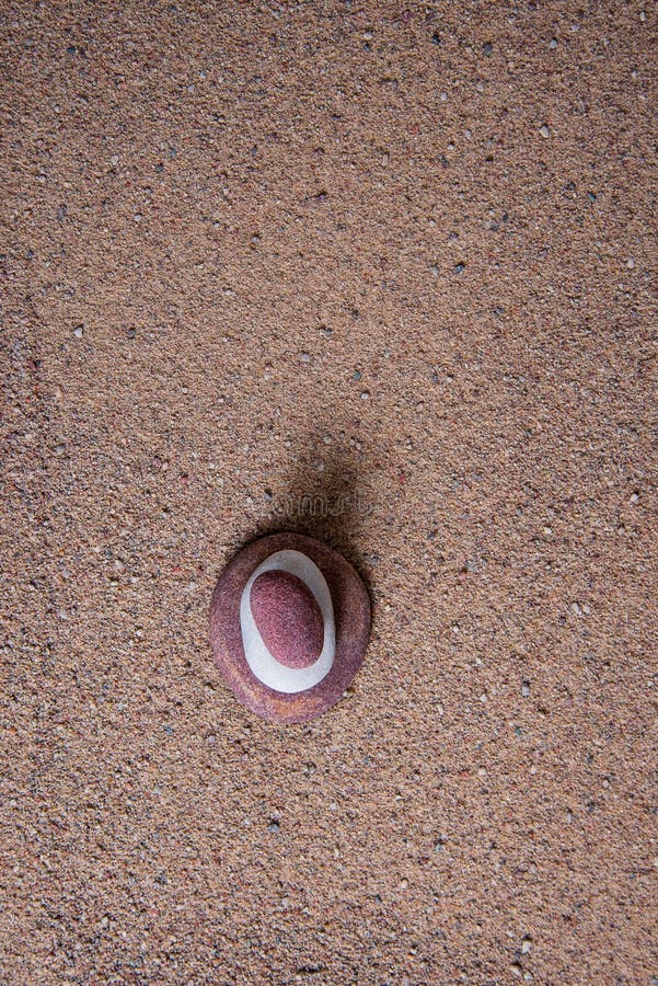 Relaxing Stones Laying on Sand Textured Pattern Stock Photo - Image of ...