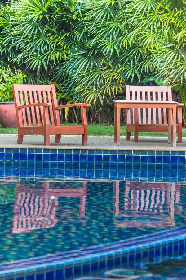 Relaxing Table Set beside Swimming Pool. Stock Photo - Image of pool ...