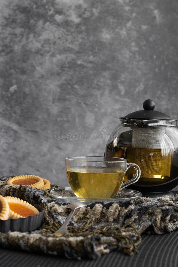Relaxing Tea Time Concept. Dark Mood View of Herbal Tea and Cookies ...
